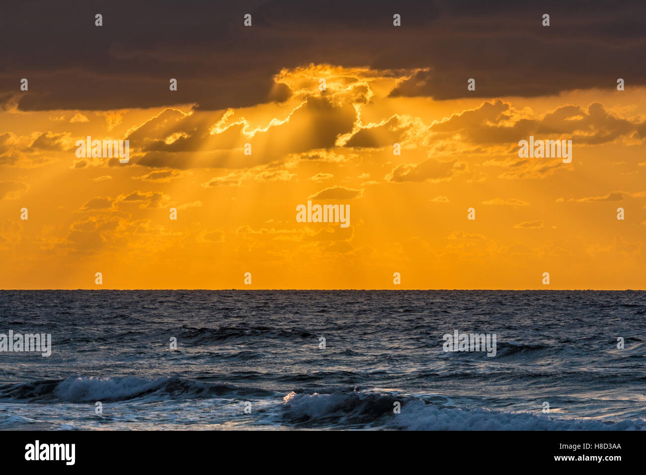 landscape, sea waves on the sunset background Stock Photo - Alamy