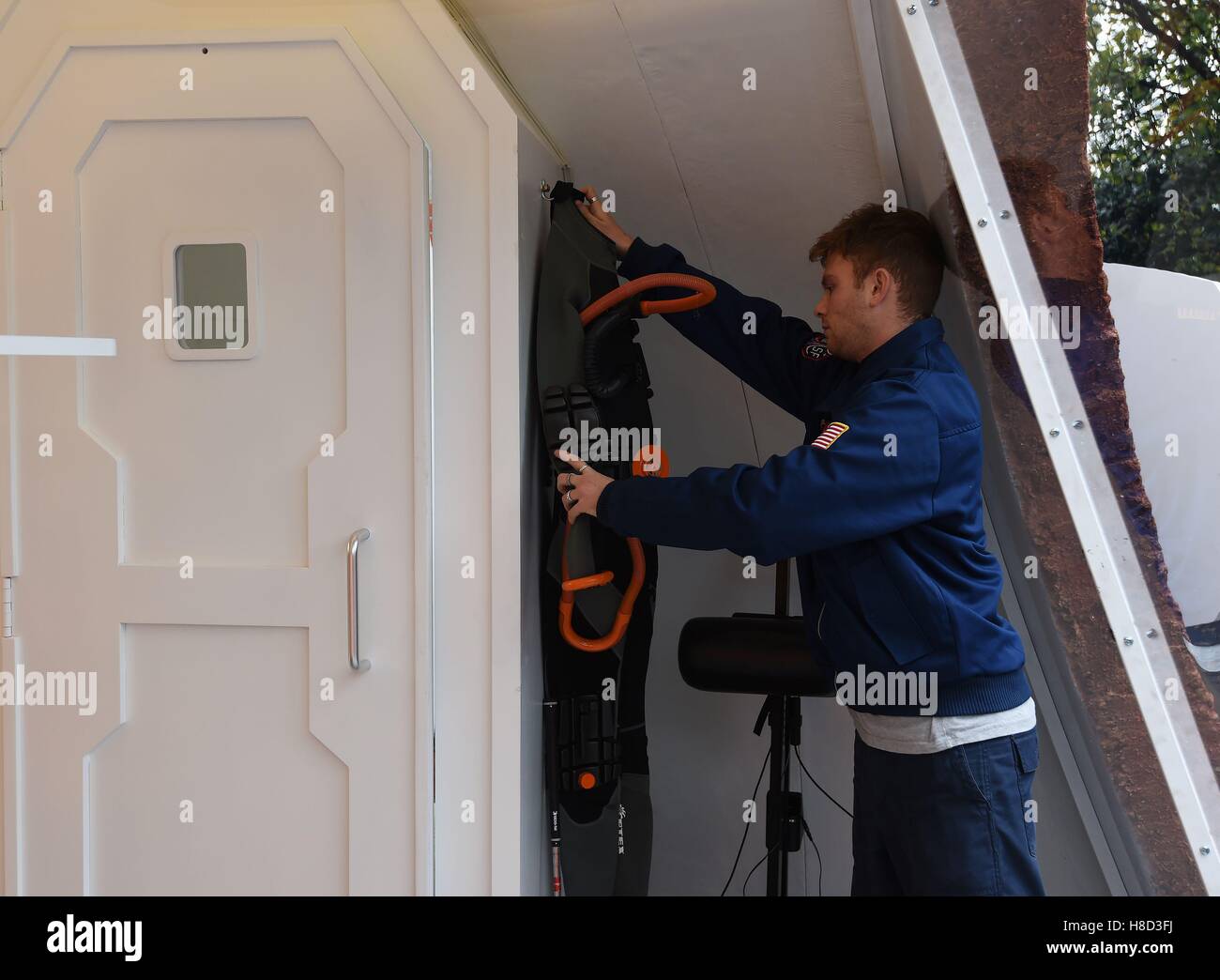 Billy Holmes picks up a space suit in the first ever Mars show home ...