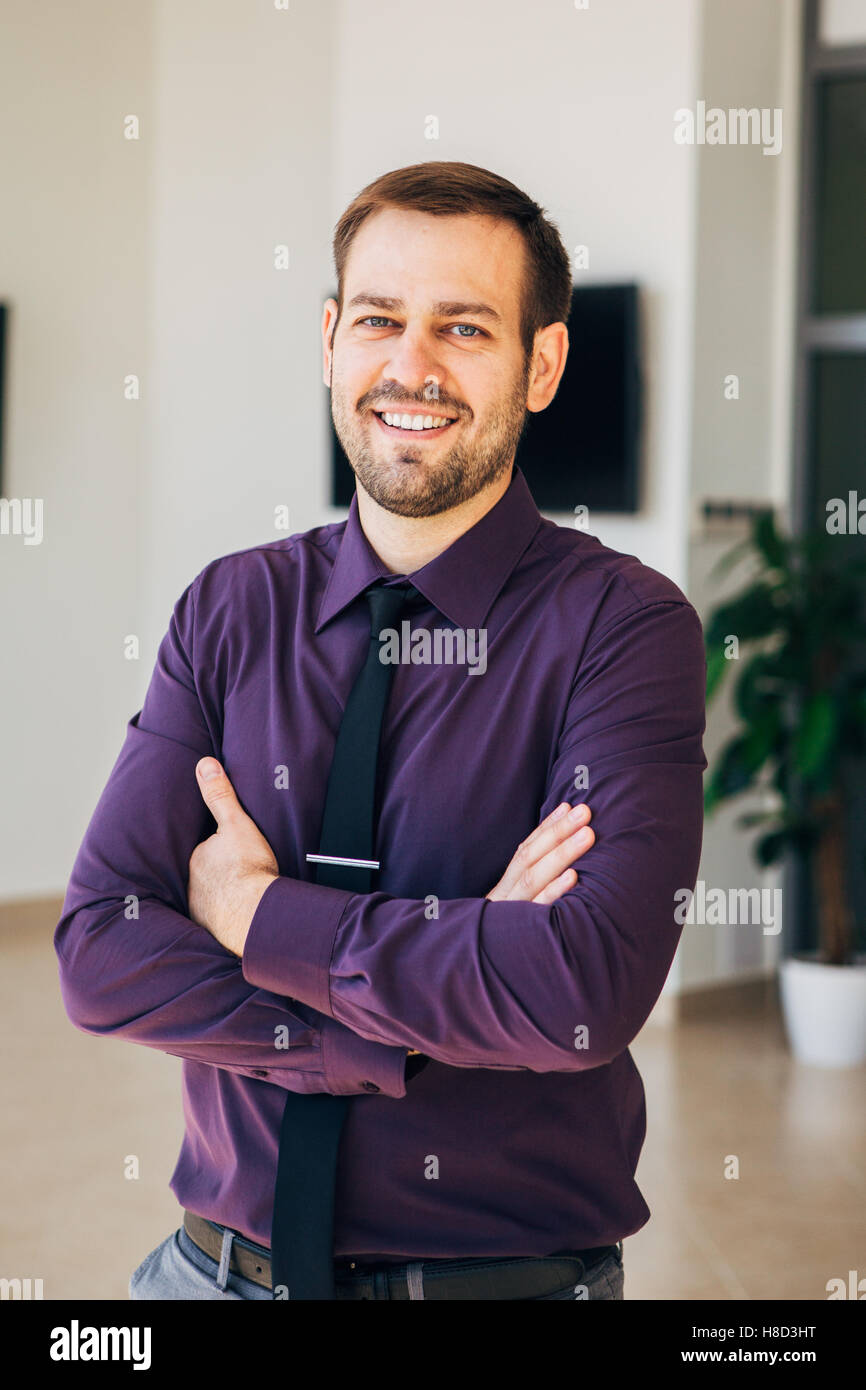 portrait of a businessman in purple shirt Stock Photo - Alamy