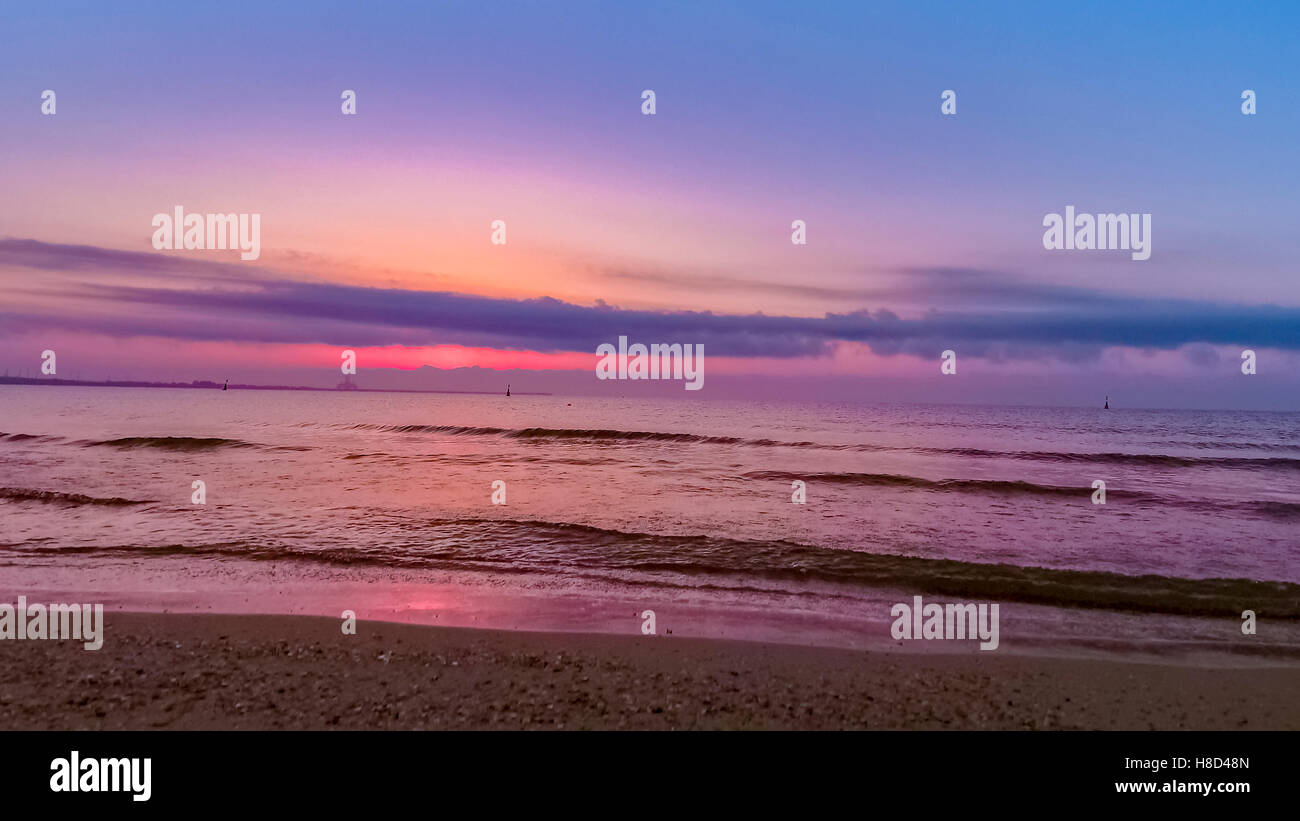 radiant sea beach sunrise Stock Photo - Alamy