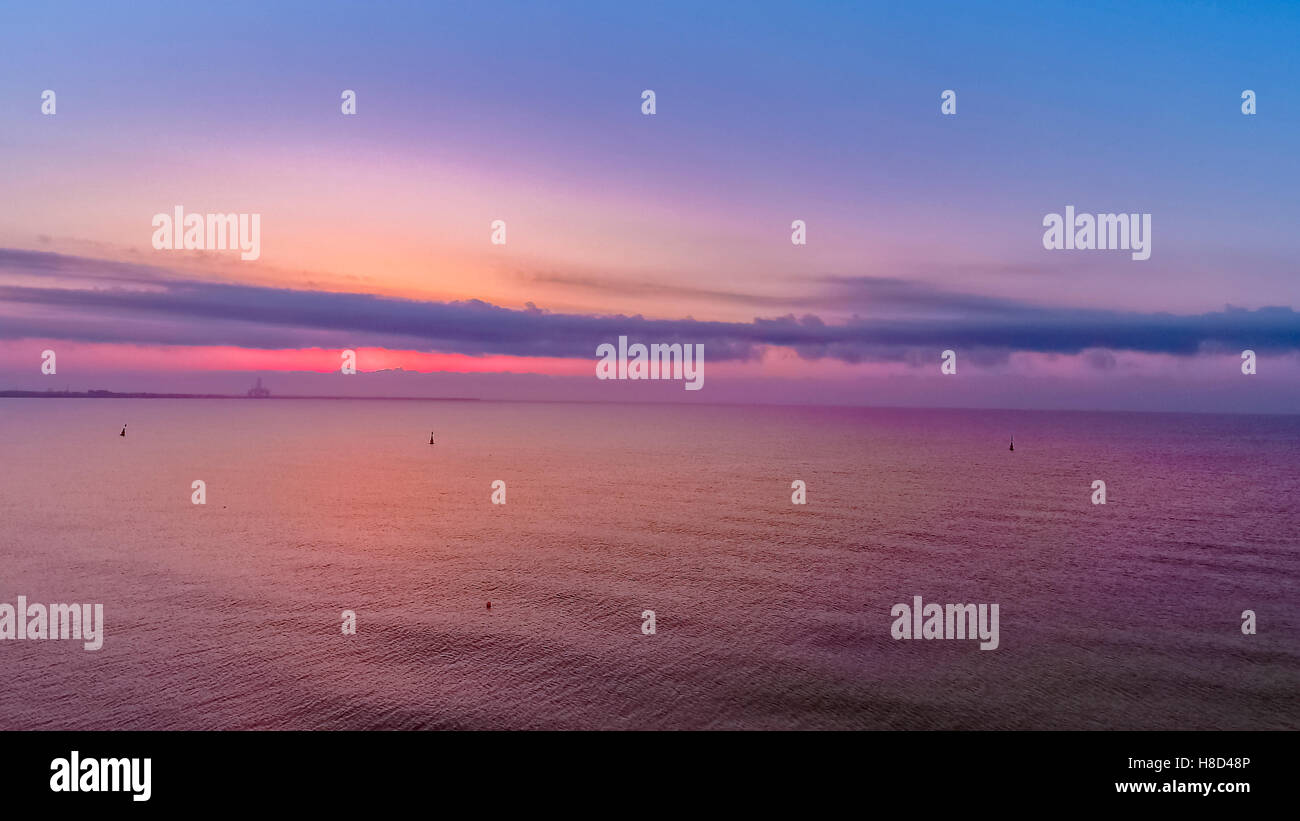 radiant sea beach sunrise Stock Photo - Alamy