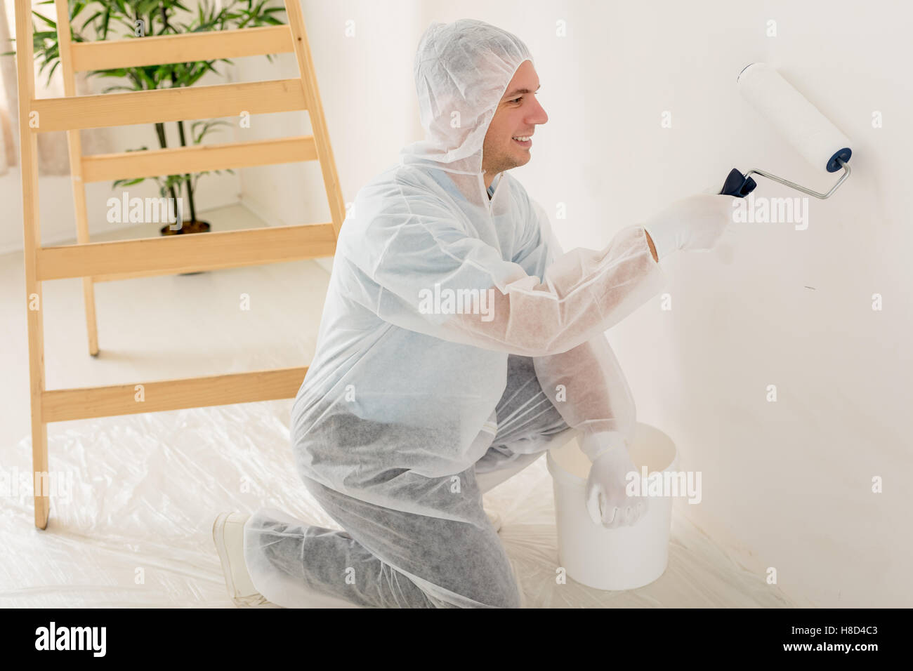 Man whitewashing house hi-res stock photography and images - Alamy