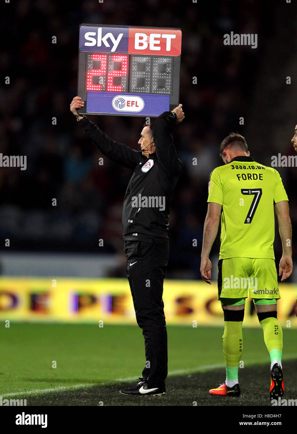 The fourth official holds up the electronic board Stock Photo - Alamy