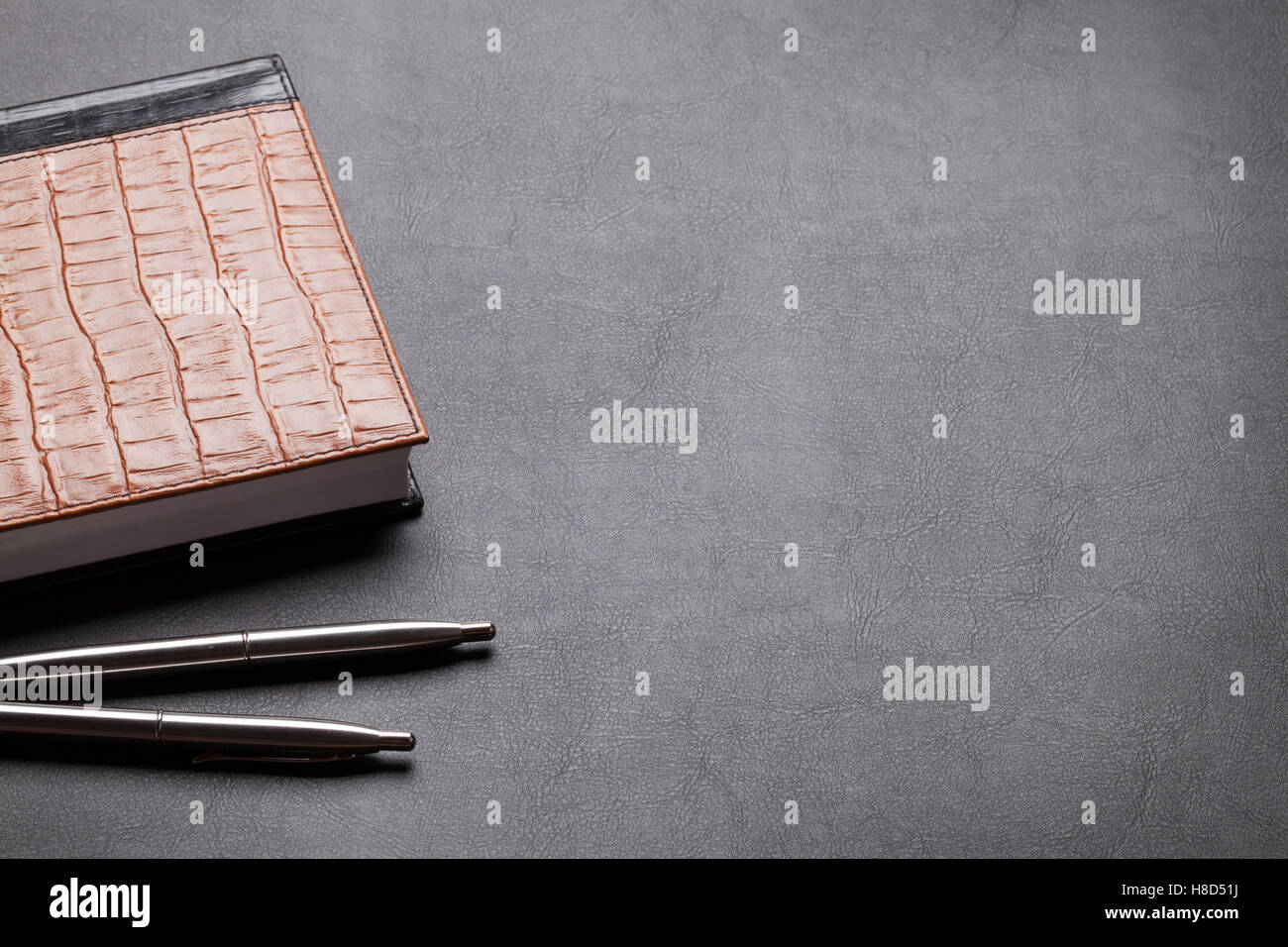 Office leather desk table with notepad, pen and pencil. View with copy ...