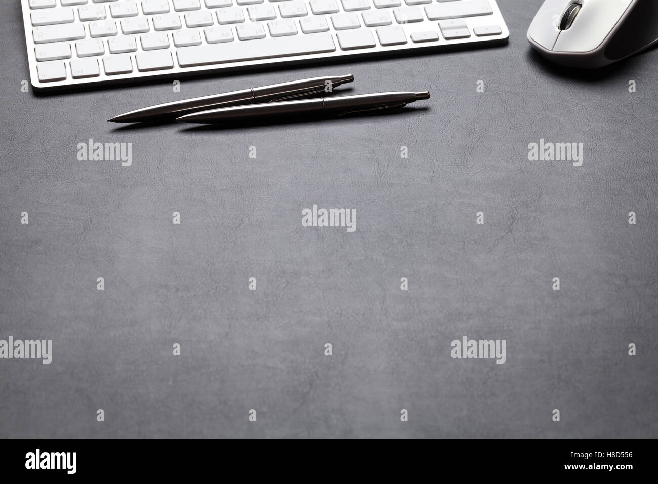 Office leather desk table with pc, pencil and pen. View with copy space ...