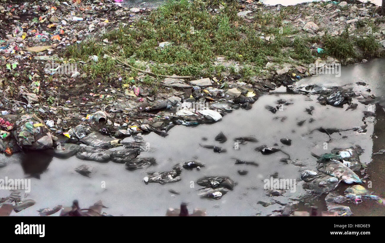 Plastic Contamination into Nature. Garbage and bottles floating on ...