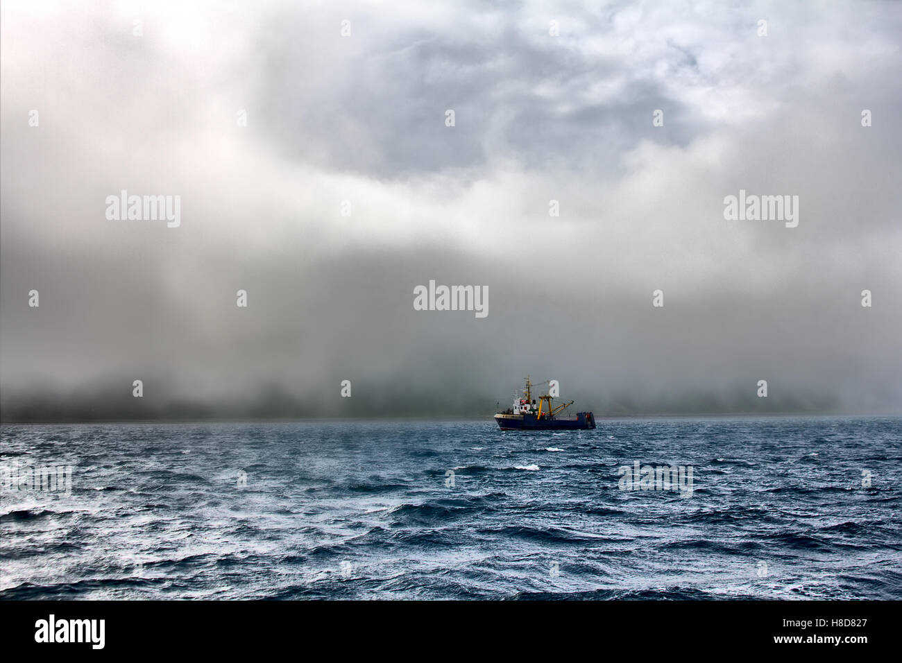 Fishing trawler during a storm in Pacific ocean near Commander Islands ...