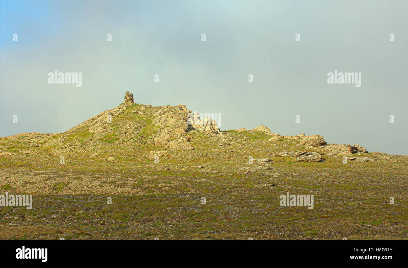 Old cairn in Arctic wilderness photographed against background of ...