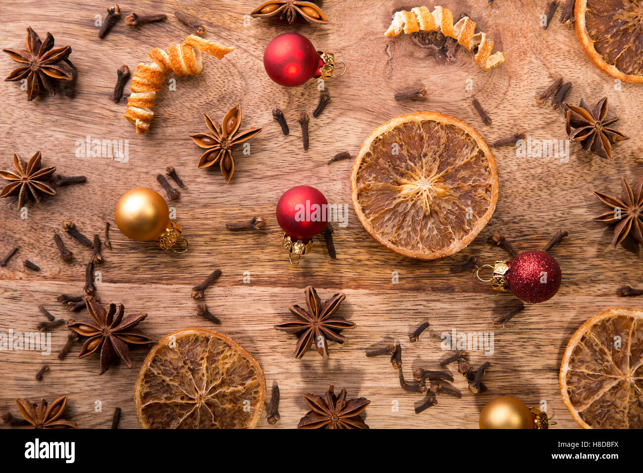 star anise, cloves, dried orange and christmas ball on wood Stock Photo ...
