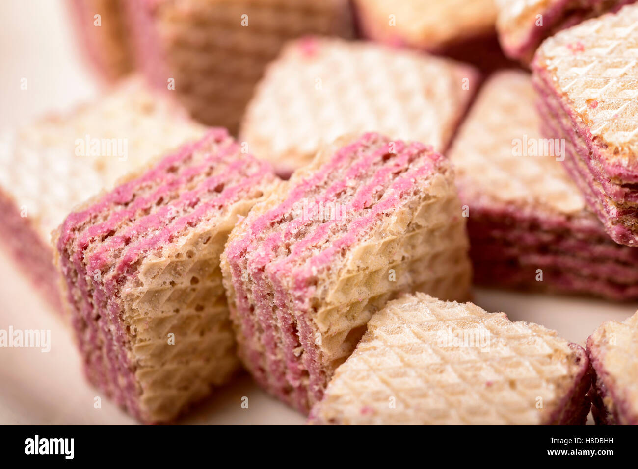 macro wafers stuffed with raspberry cream over wood Stock Photo - Alamy