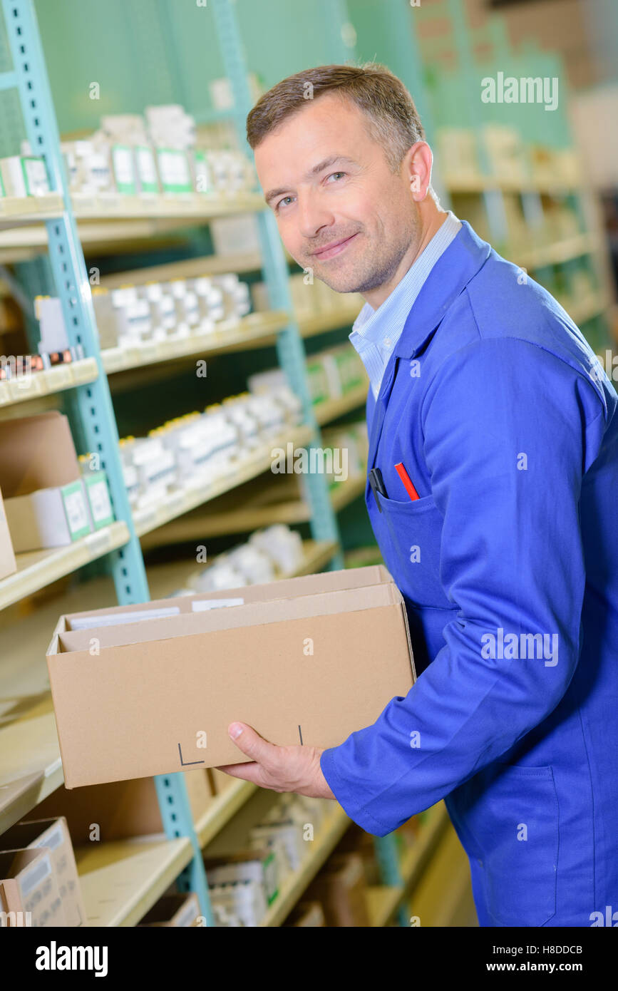 man carrying a box Stock Photo - Alamy