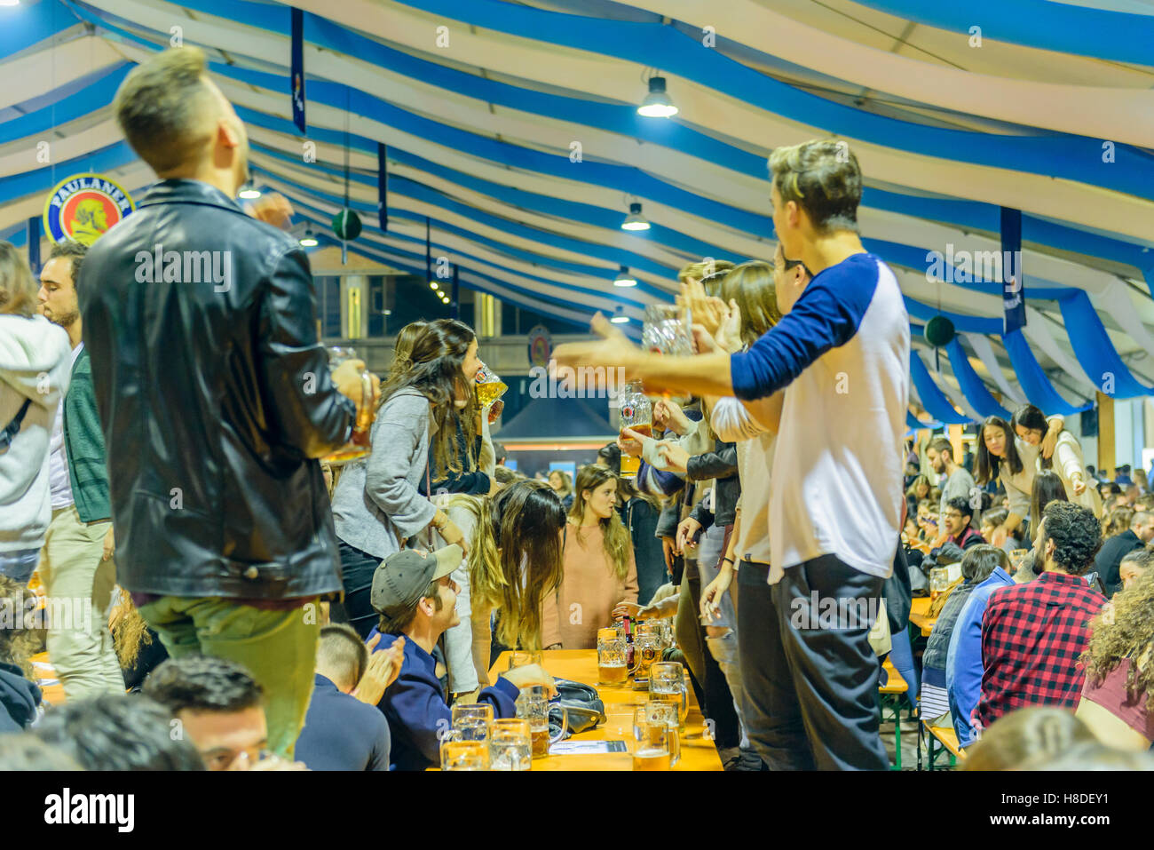 People dancing up the tables in the Oktoberfest 2016 (Barcelona, Spain ...