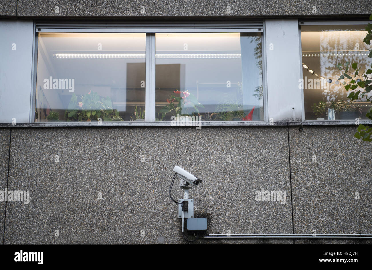 Munich, Germany. 11th Nov, 2016. A video camera hanging on the facade ...