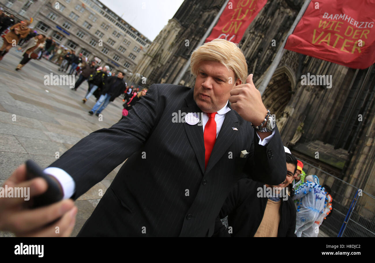 Cologne, Germany. 11th Nov, 2016. A carnivalist dressed as Donald Trump ...