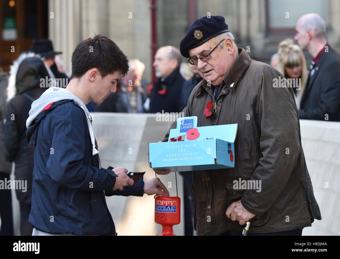 Boy buying poppy hi-res stock photography and images - Alamy