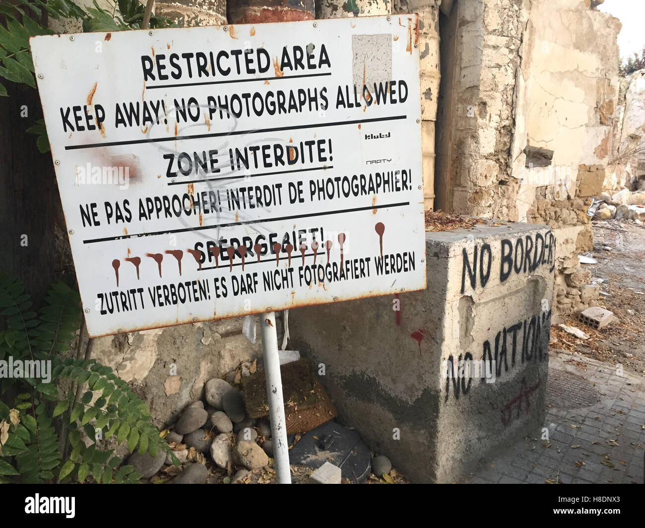 A sign reading 'restricted zone' in the buffer zone (green line) in the ...