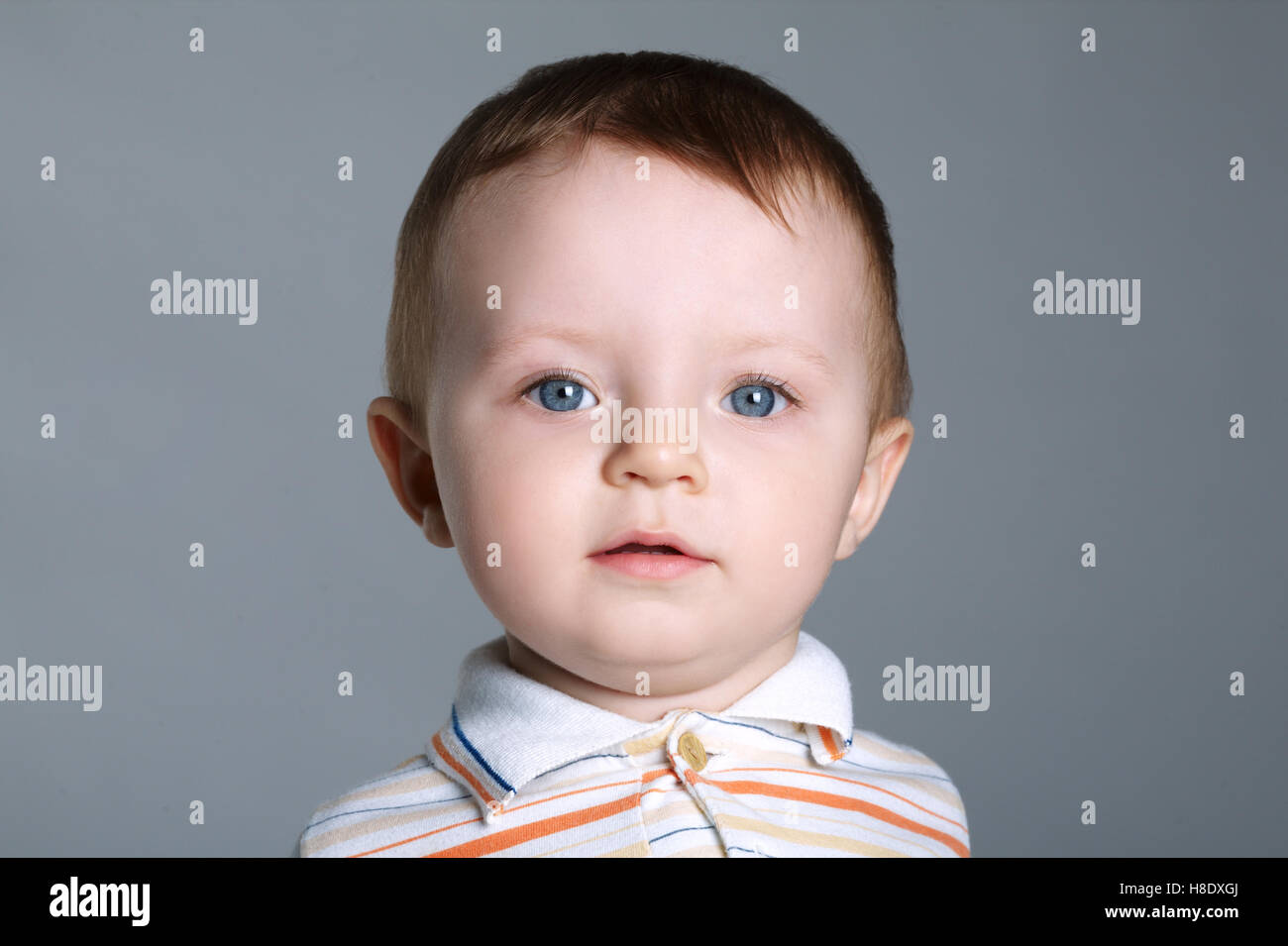 little beautiful boy on bright background Stock Photo - Alamy