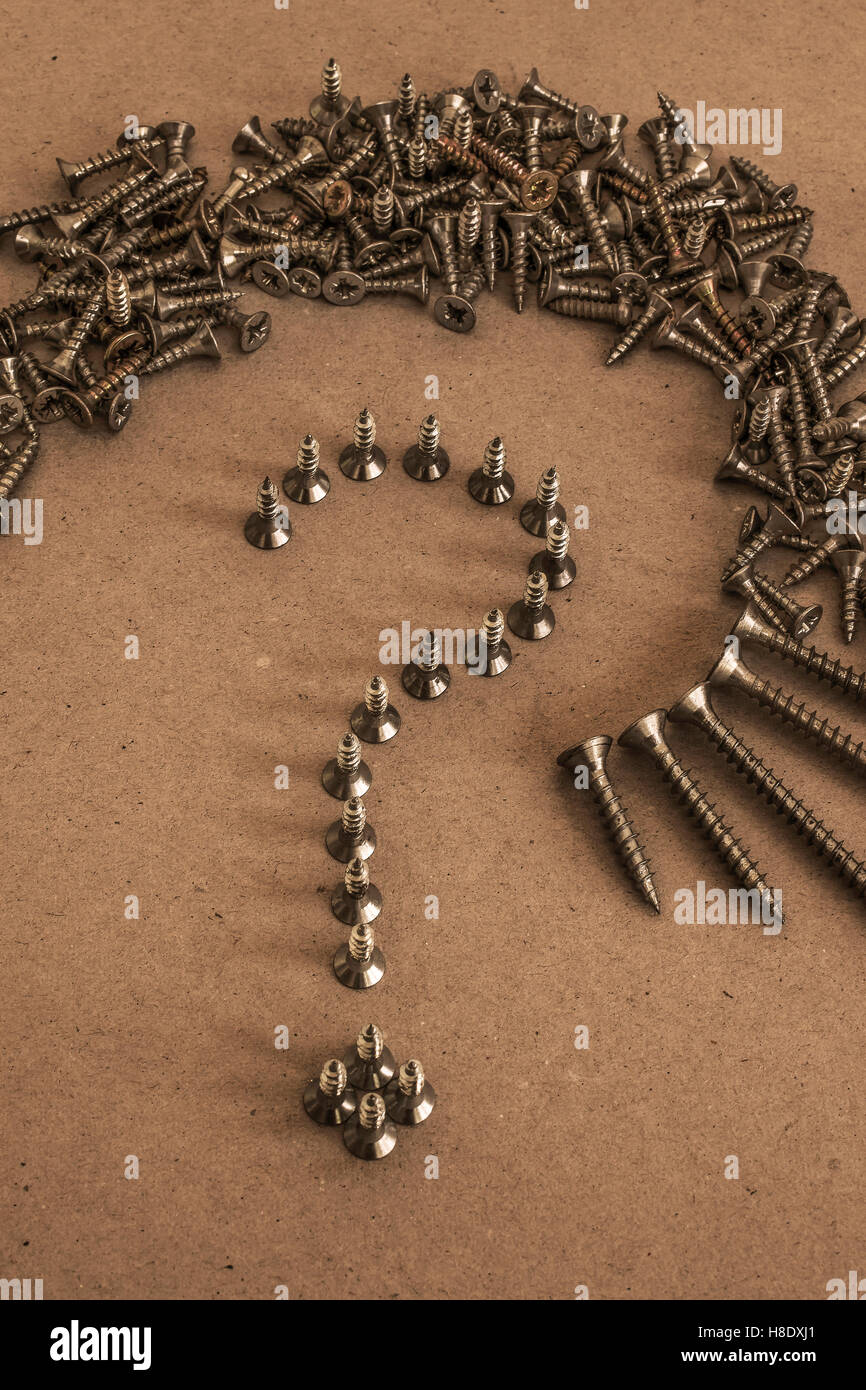 Pile and Line of Screws in shape of Question Mark Stock Photo - Alamy