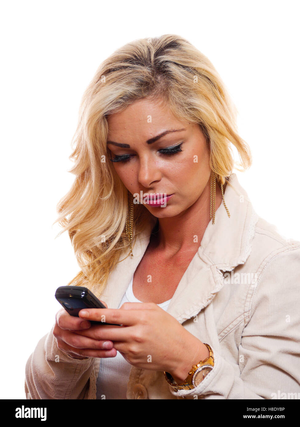 A woman is sending a text message on her cell phone Stock Photo - Alamy