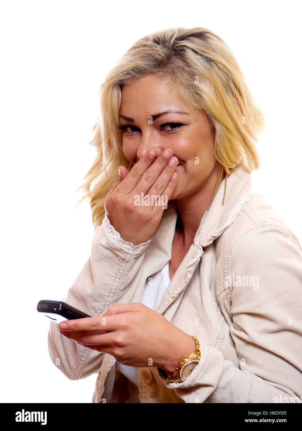 A woman is laughing while holding her cell phone Stock Photo - Alamy