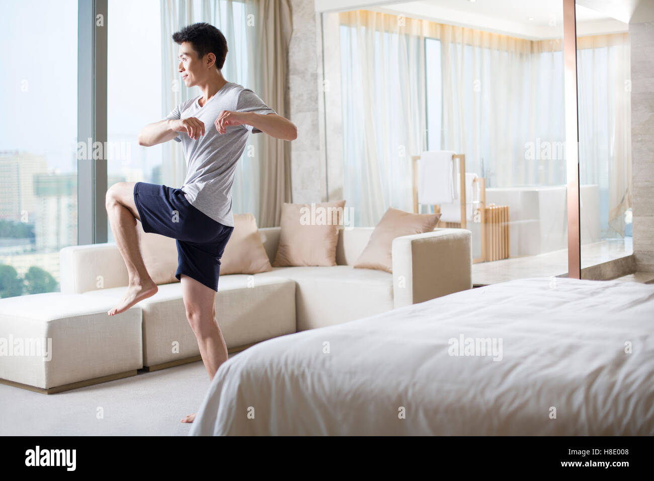 Young Chinese man exercising at home Stock Photo - Alamy