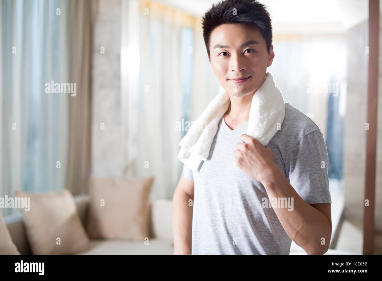 Young Chinese man exercising at home Stock Photo - Alamy