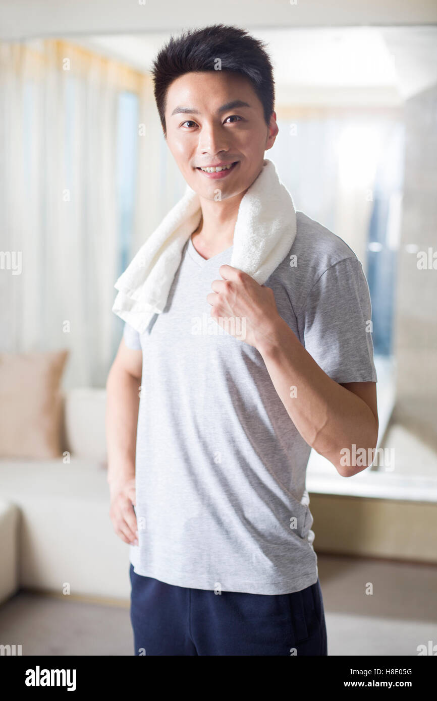 Young Chinese man exercising at home Stock Photo - Alamy