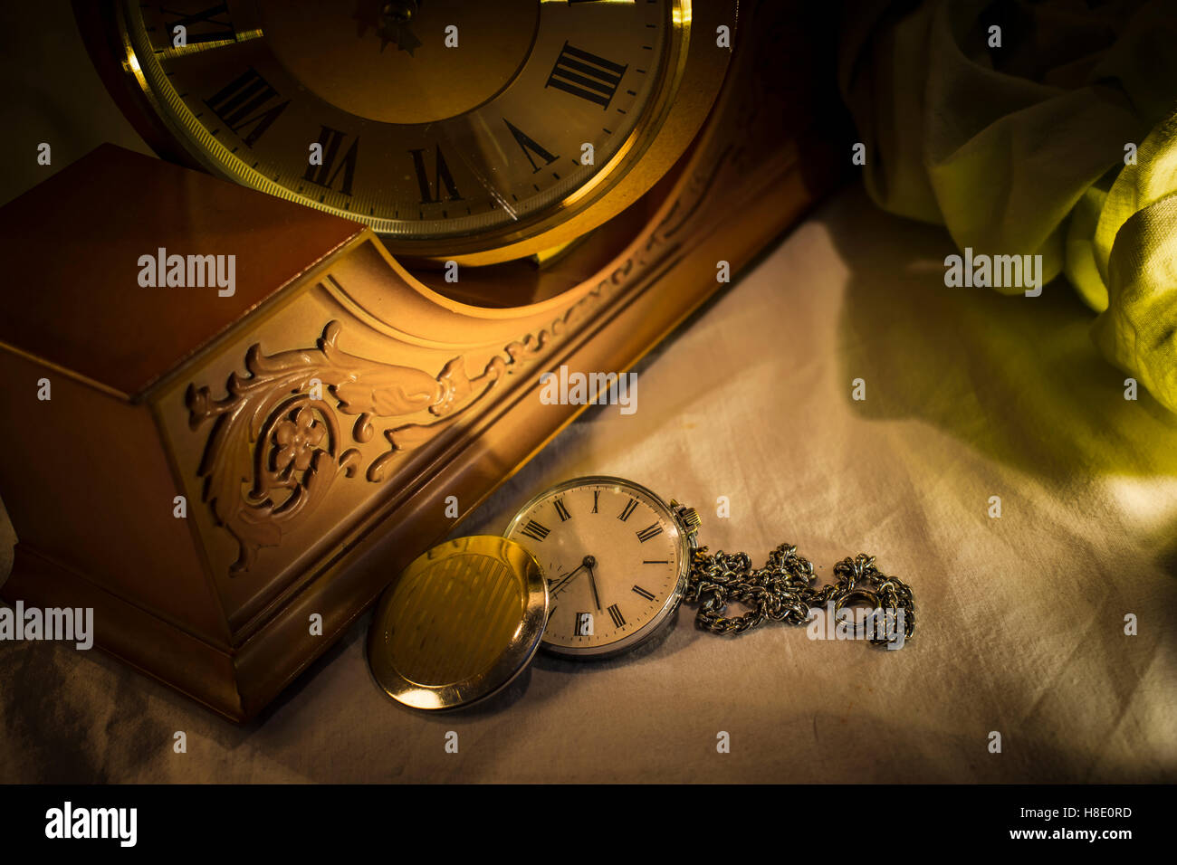 Old Pocket Watch and Old Wall Clock Stock Photo - Alamy