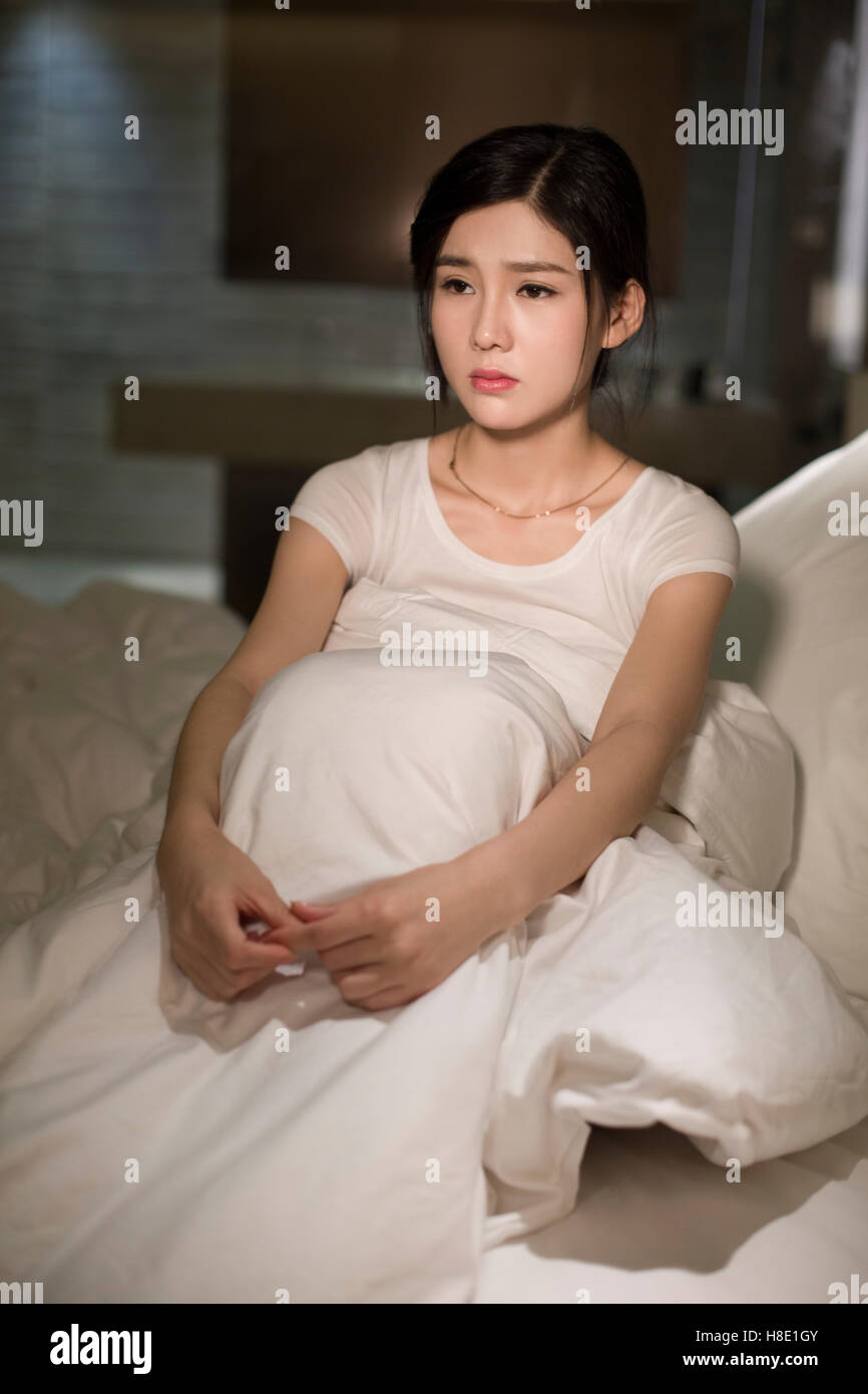 Young Chinese woman suffering from insomnia Stock Photo - Alamy