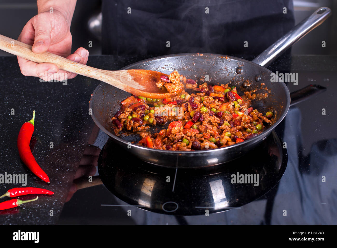 Chef preparing dishes in a frying pan. Cooking Stock Photo - Alamy