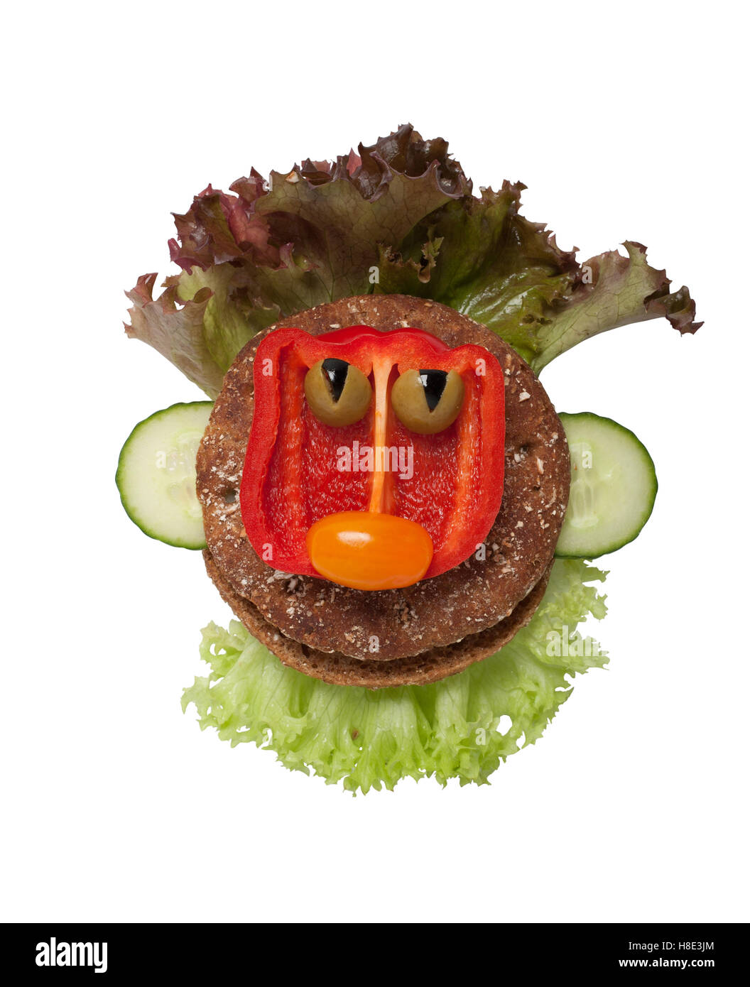 Serious face with beard made of bread and vegetables on white ...