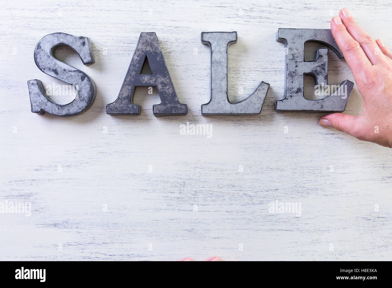 Tags with sale sign on wood board Stock Photo - Alamy