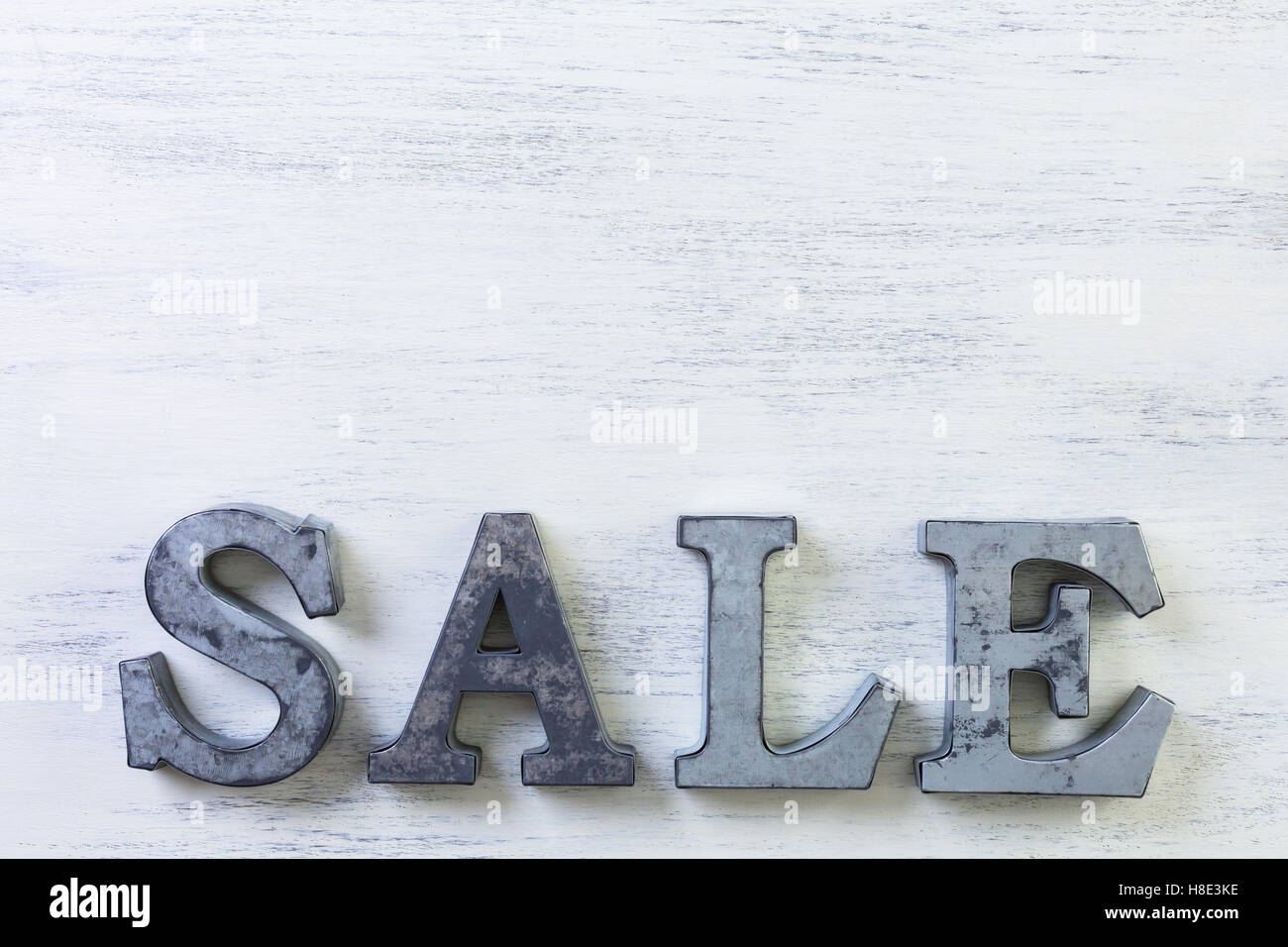 Tags with sale sign on wood board Stock Photo - Alamy