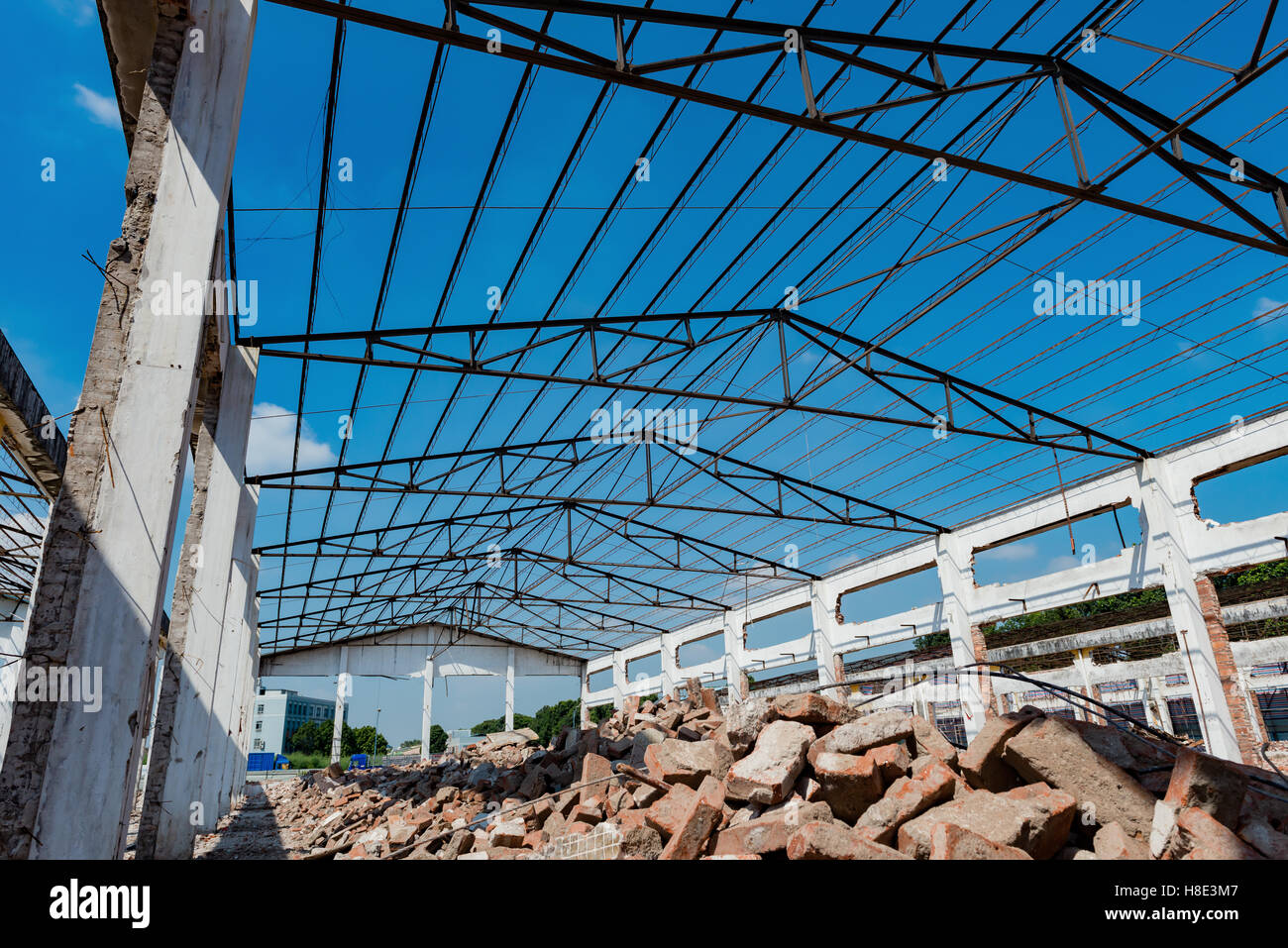 Demolition of an old factory building with steel roof Stock Photo - Alamy