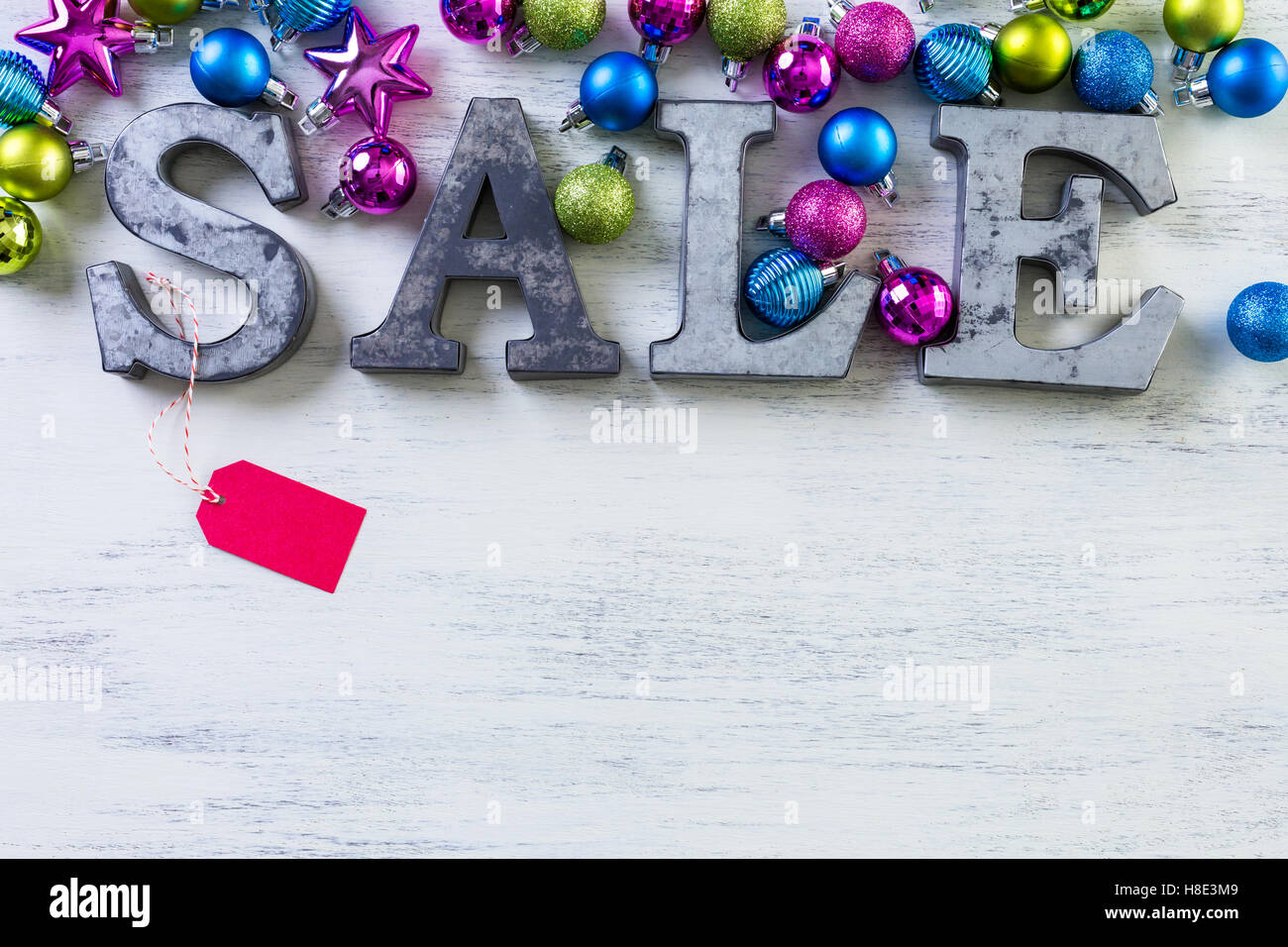 Tags with sale sign on wood board Stock Photo - Alamy