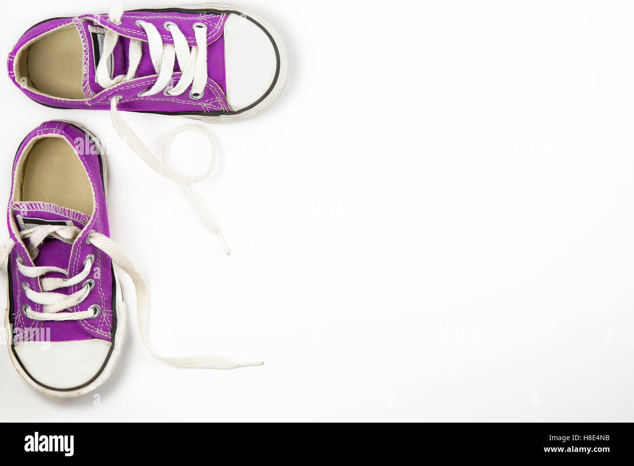 portrait of a little girl sneakers shoes Stock Photo - Alamy