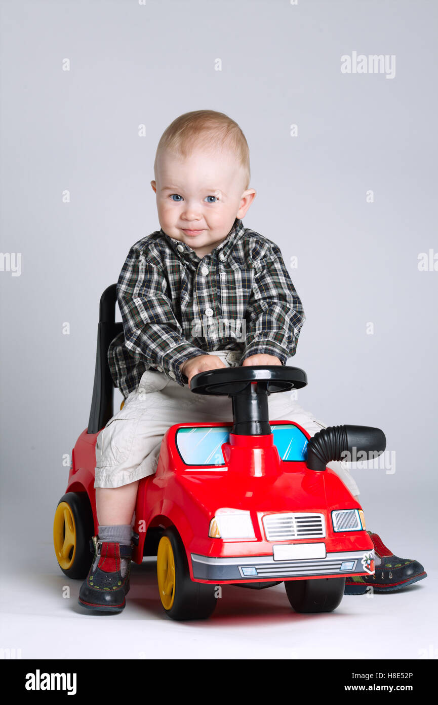 little boy driving toy car Stock Photo - Alamy