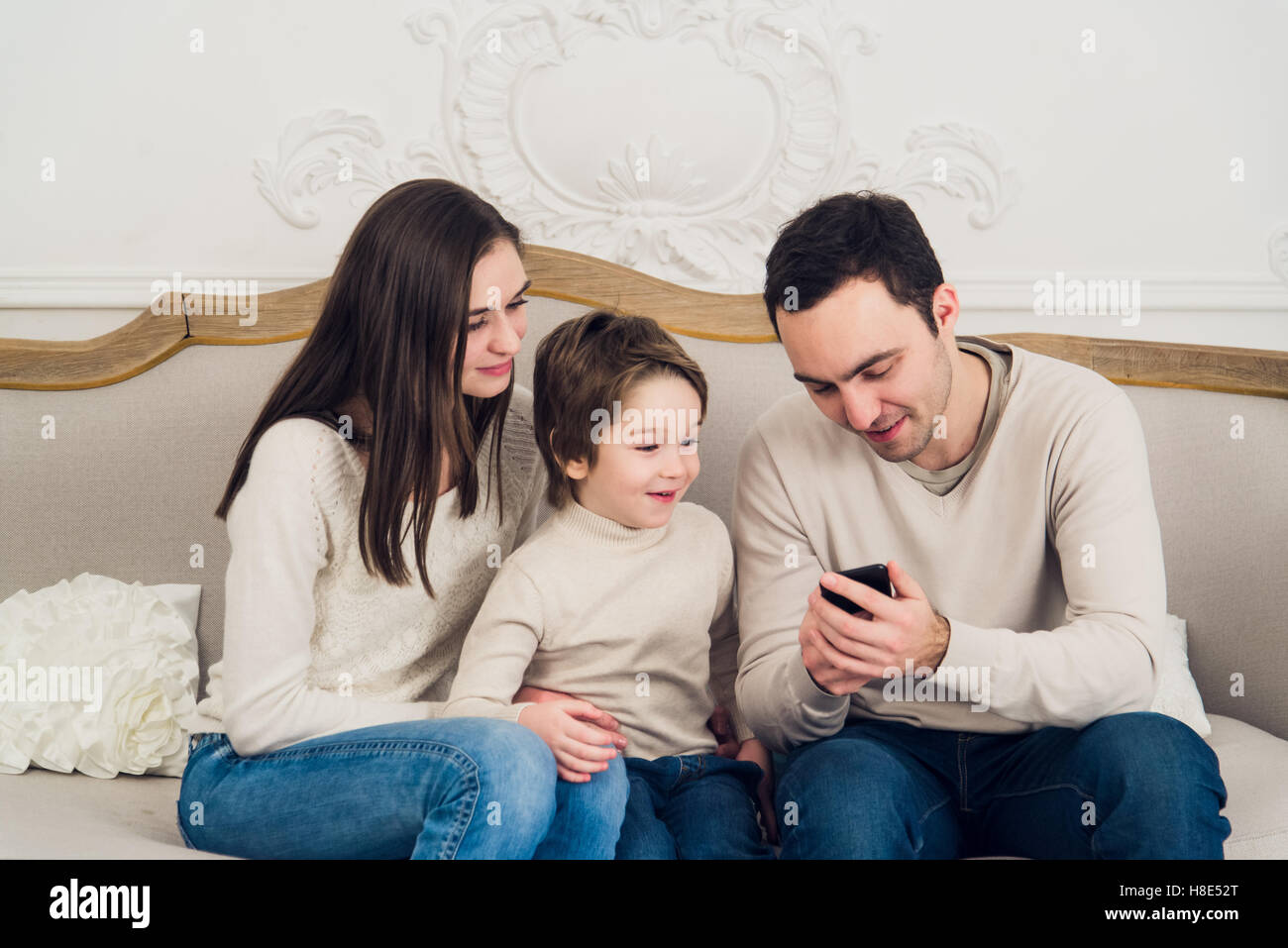 Family playing video game on smart phone Stock Photo - Alamy