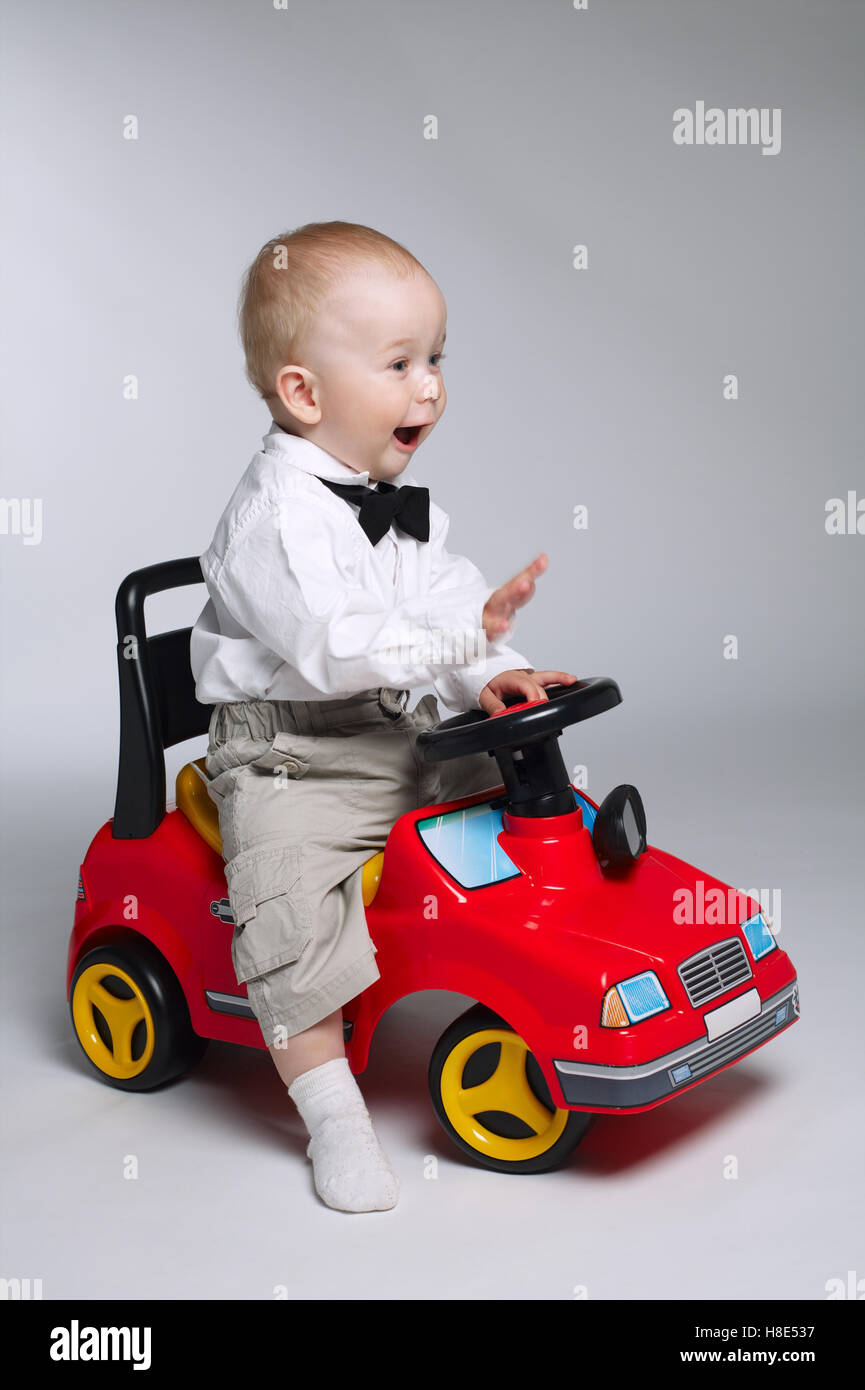 little boy driving toy car Stock Photo - Alamy