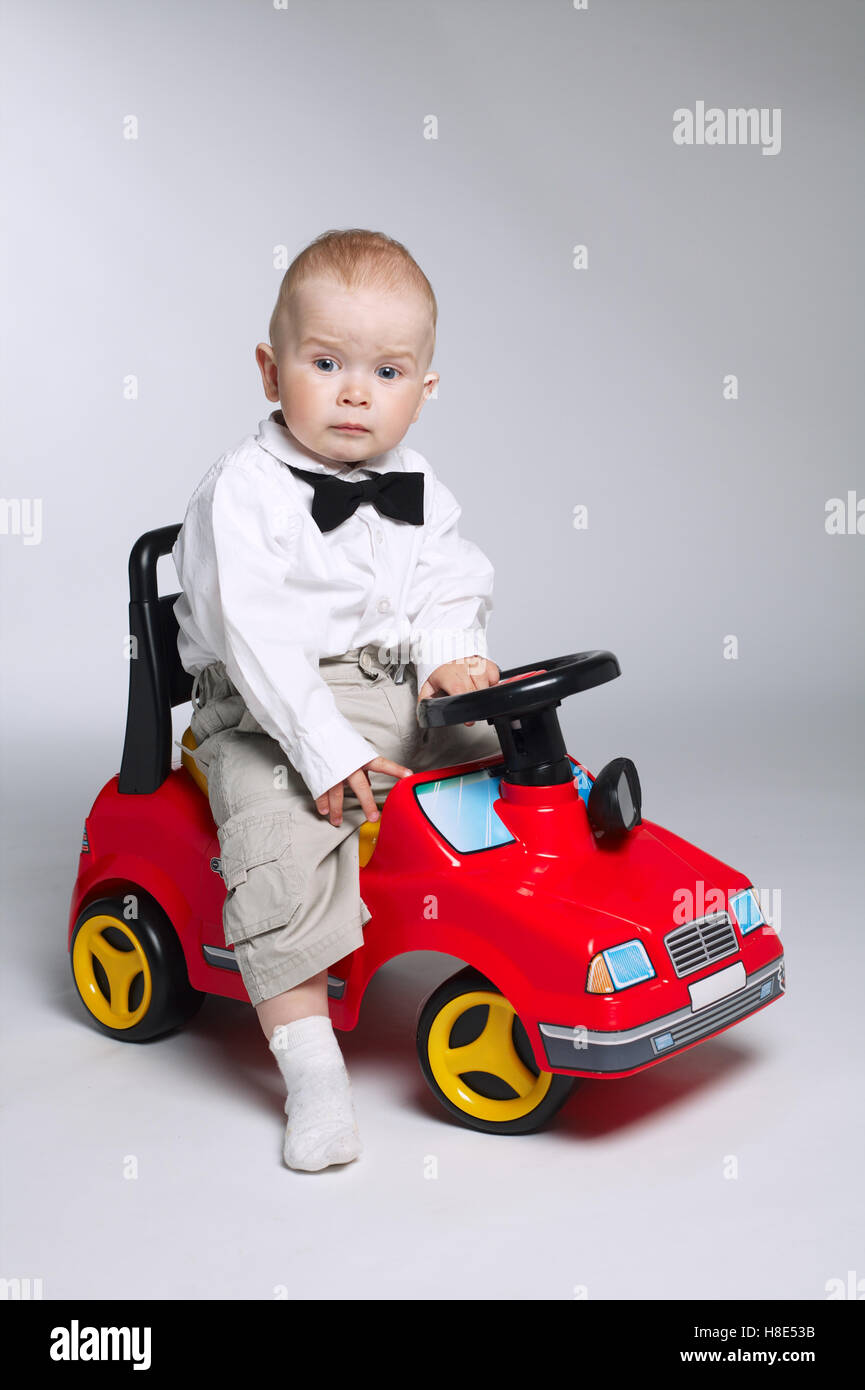 little boy driving toy car Stock Photo - Alamy