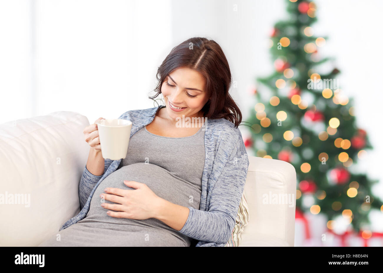 happy pregnant woman with cup drinking tea at home Stock Photo - Alamy