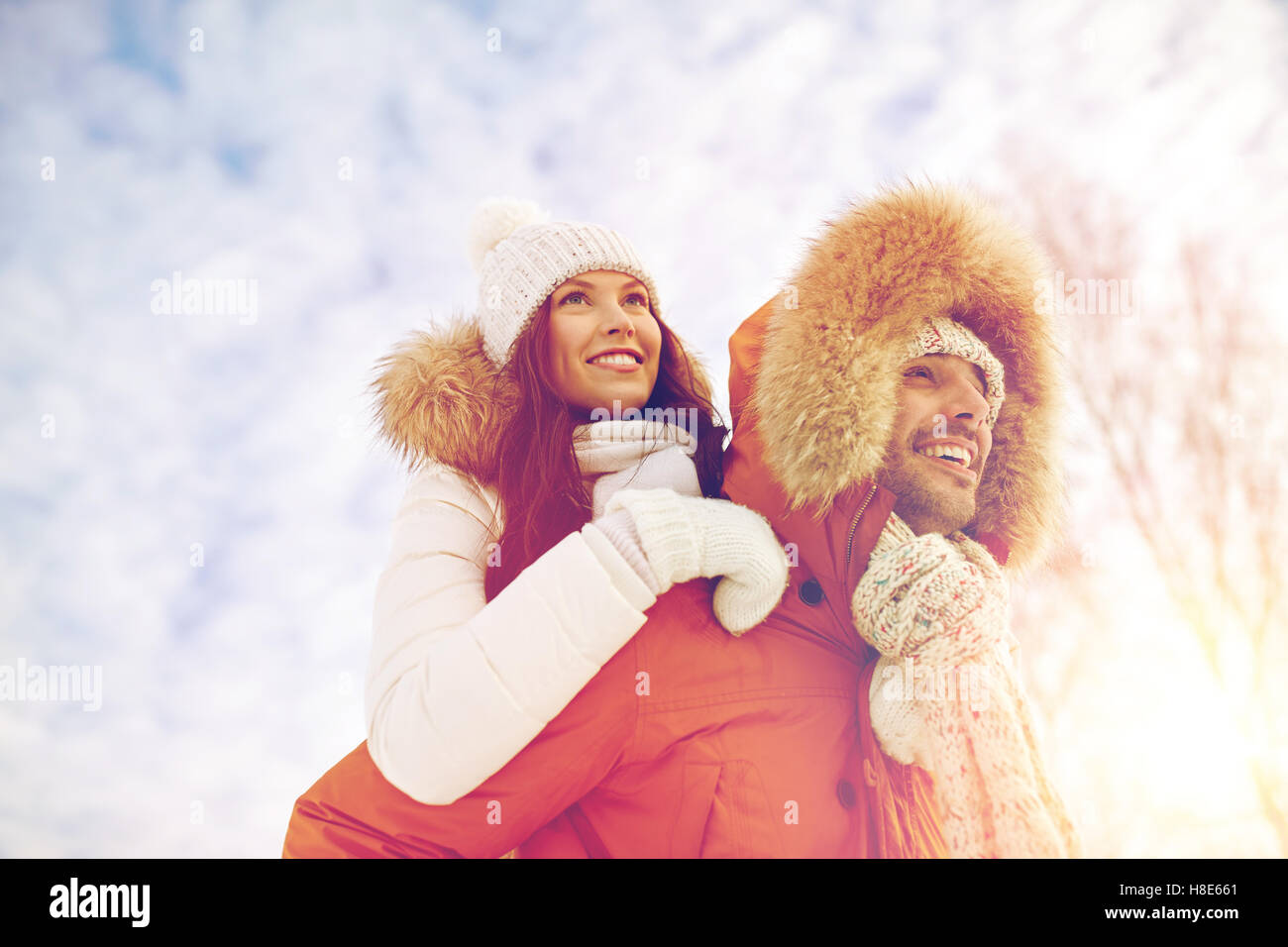 happy couple having fun over winter background Stock Photo - Alamy