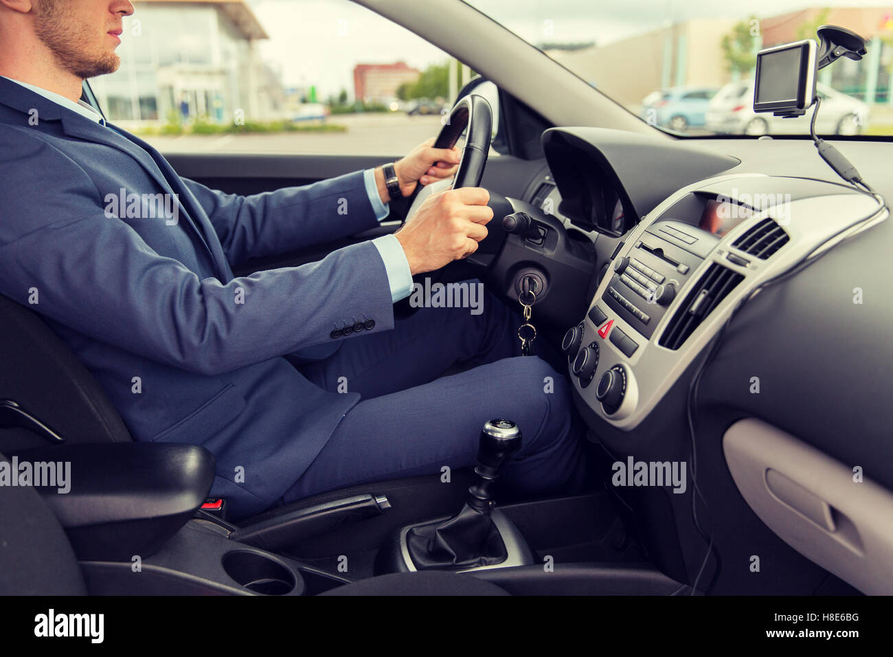 close up of young man in suit driving car Stock Photo - Alamy
