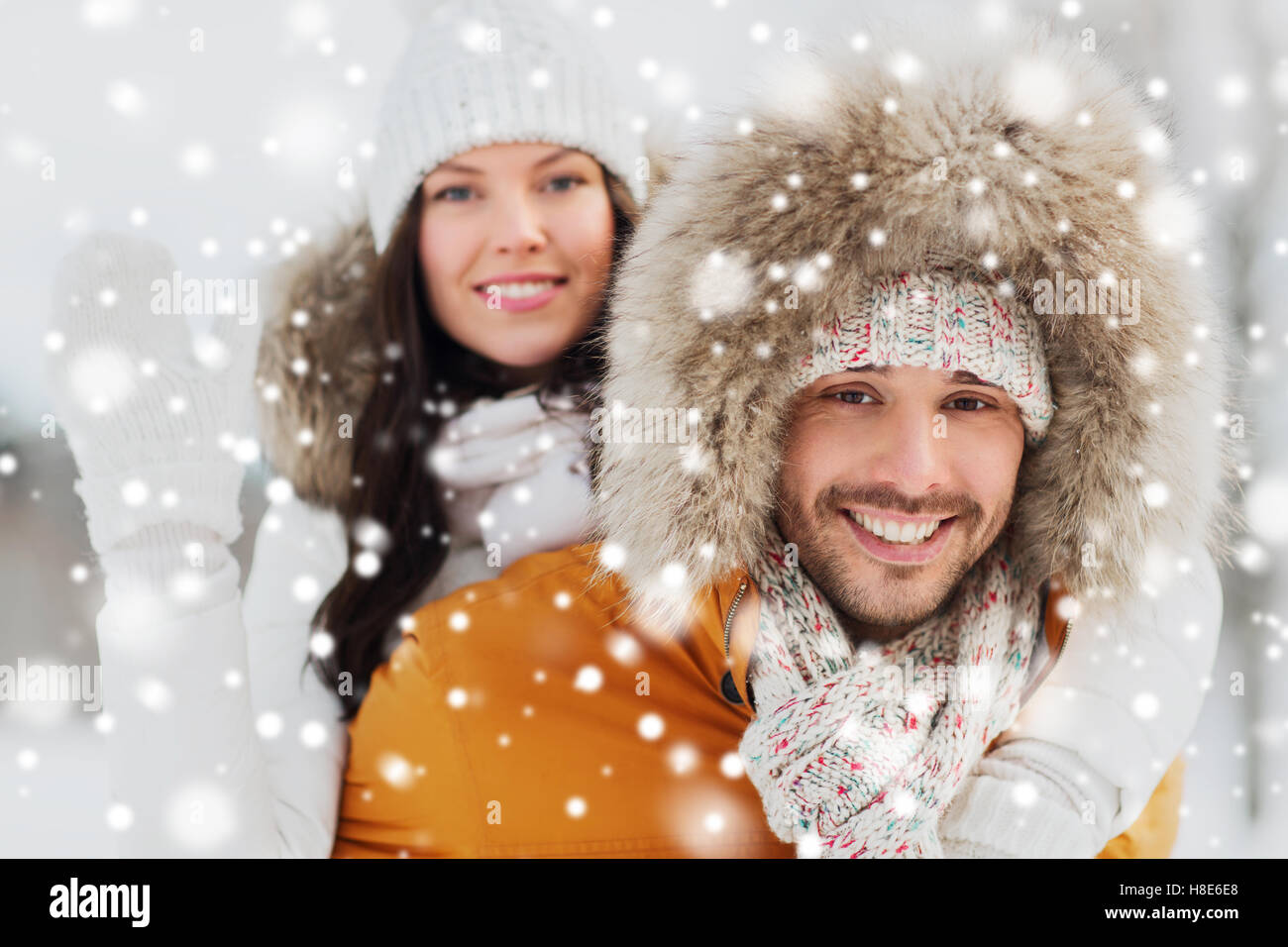 happy couple having fun over winter background Stock Photo - Alamy