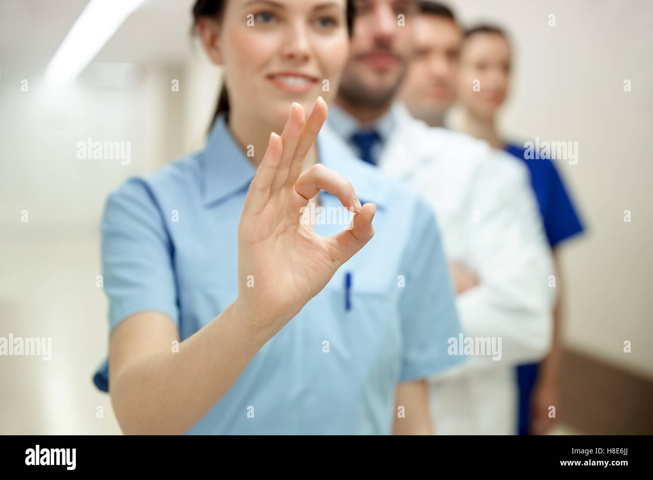 close up of doctors at hospital showing ok sign Stock Photo - Alamy