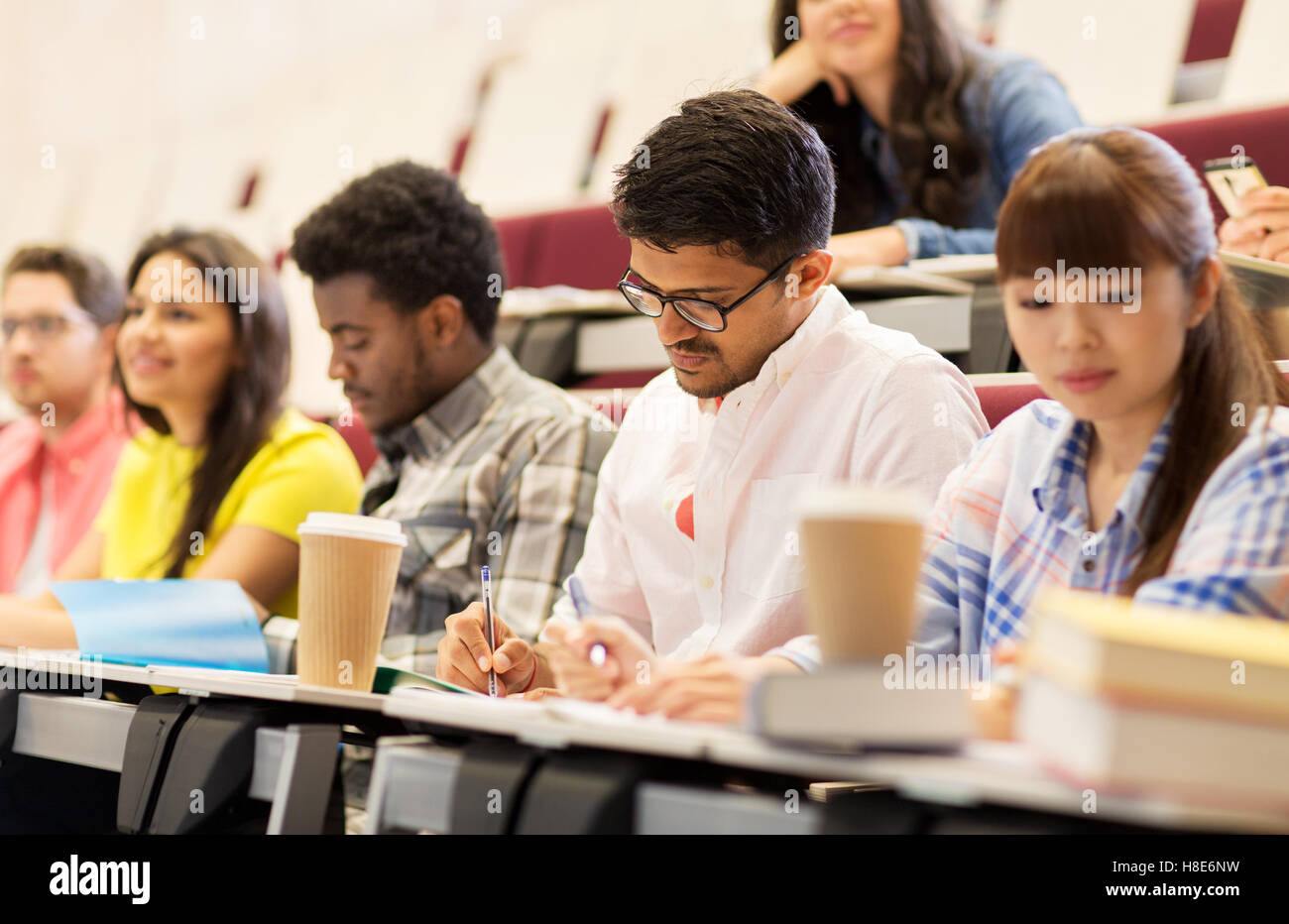 group of students with coffee writing on lecture Stock Photo - Alamy