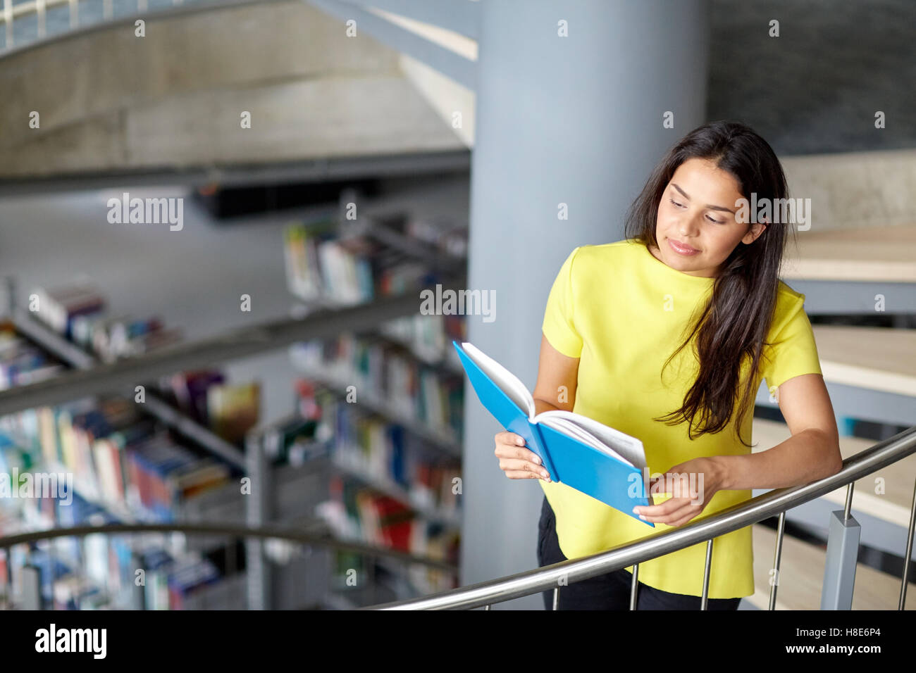 high school student girl reading book at library Stock Photo - Alamy