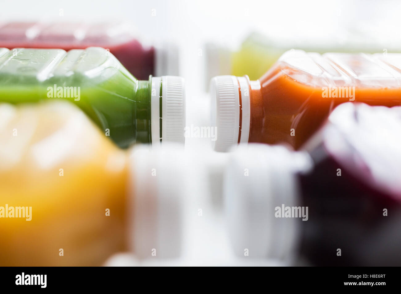 bottles with different fruit or vegetable juices Stock Photo - Alamy