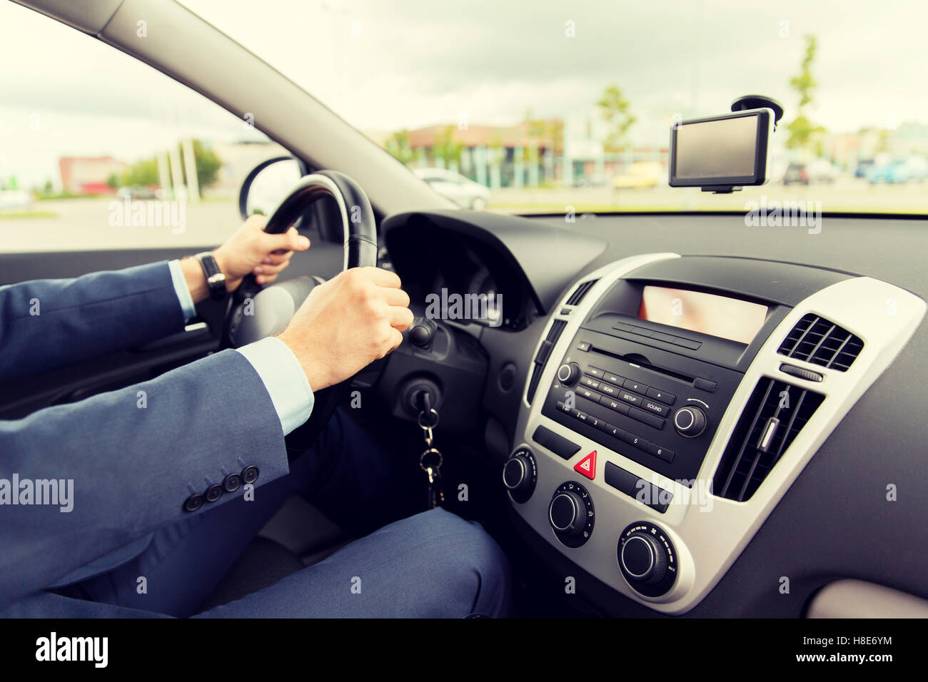close up of young man in suit driving car Stock Photo - Alamy