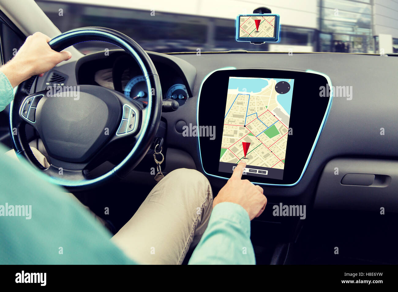 close up of man driving car and using navigator Stock Photo - Alamy